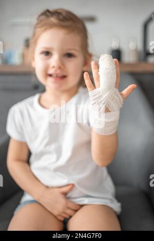 Little girl with broken finger at the doctor's appointment in the ...