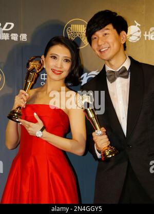 Malaysian singer Penny Tai, left, poses with her Taiwanese husband ...