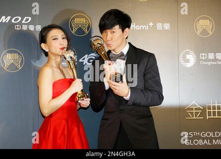 Malaysian singer Penny Tai, left, poses with her Taiwanese husband ...