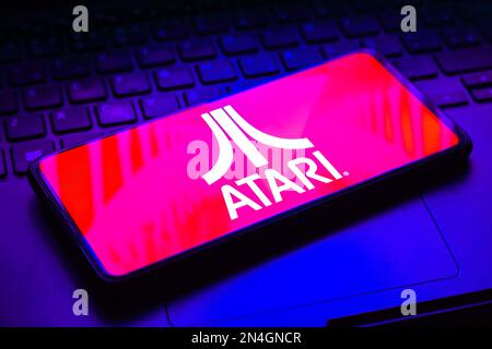 In this photo illustration, the Atari logo is displayed on a smartphone ...