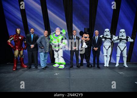 A man in a Buzz Lightyear costume smokes as he arrives to attend the ...