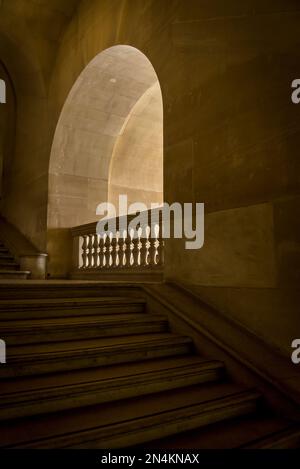 Architectural detail of an arch and balustrade, Louvre Museum, the ...