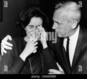Lucille Miller and her attorney, Edward P. Foley, examine a list of 55 ...