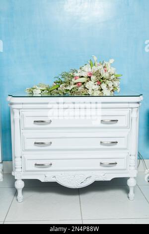 Bouquet of flowers on the nightstand Stock Photo - Alamy