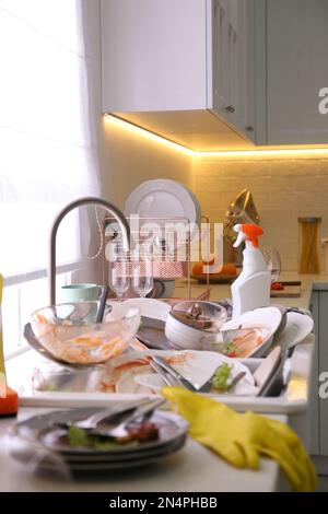 Dirty dishes in kitchen after new year party Stock Photo - Alamy