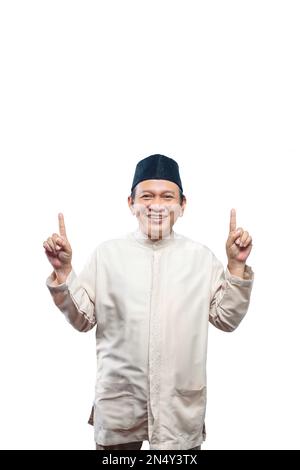 Asian Muslim man pointing to something with a mosque background Stock ...