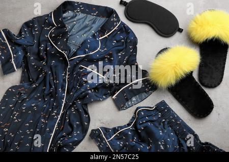 Stylish sleeping mask on table in bedroom Stock Photo - Alamy