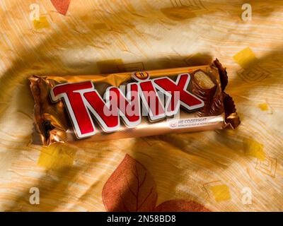 Twix cookie bars on a brown background. Twix is a chocolate bar made by ...