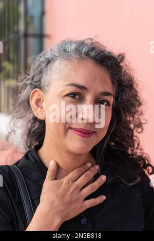 Closeup Portrait Of A Beautiful Latin Woman With Hands In Her Hair