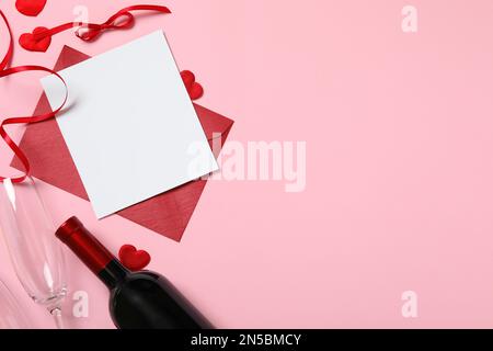 Blank card, bottle of wine, hearts and glasses on red background ...