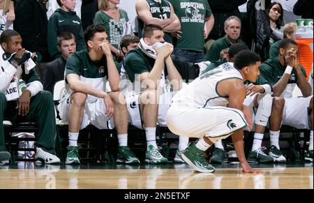 Michigan State's Alex Gauna (2) and Nebraska-Omaha's Matt Starks (55 ...
