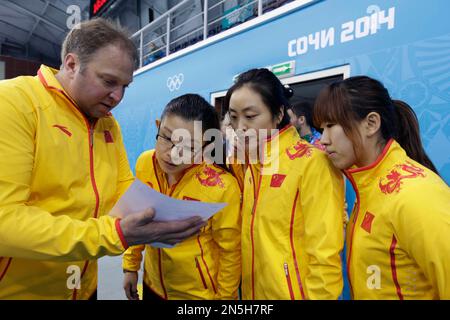 Team China coach Marcel Rocque of Canada congratulates his players ...