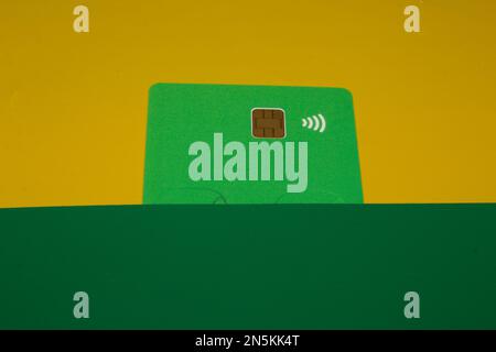 A blank card with a brown square chip symbol and an NFC. Concept of ...