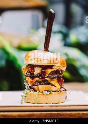 Tremendous double burger with extra cheddar cheese Stock Photo - Alamy
