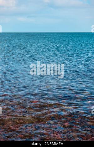 Dark gloomy sea with ripples, horizon and sky Stock Photo - Alamy