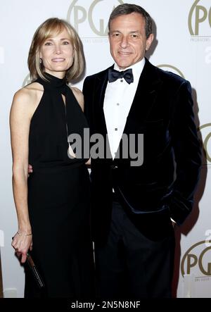 Bob Iger, right, and Susan Iger arrive at the 25th annual Producers ...