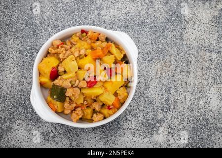 Vegan stew soy meat and vegetables in white bowl Stock Photo - Alamy