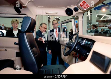 Gov. John Engler and wife Michelle pose with their triplets during a ...