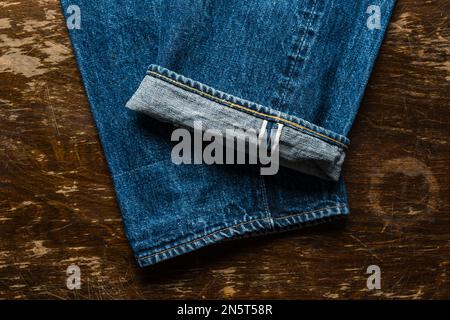 Worn and washed Japanese denim jeans with coin pocket, rivets and ...