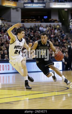 Purdue guard Bryson Scott, right, looks to shoot over Maryland-Eastern ...