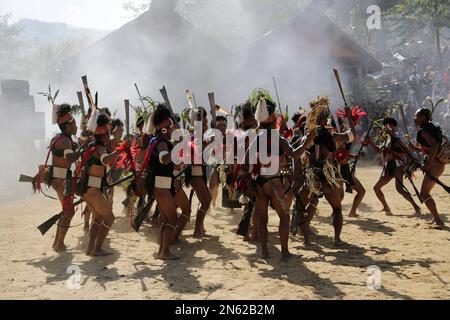 India's Naga tribal men in traditional attire perform a head hunting ...