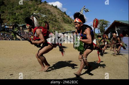 India's Naga tribal men in traditional attire perform a head hunting ...