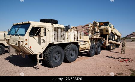 Arizona Army National Guard Sgt. Kevin Fortier provides ground guidance ...