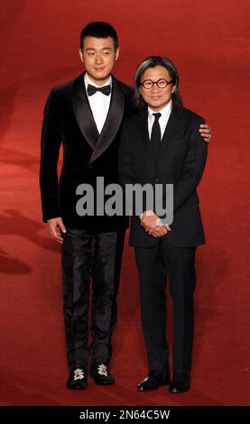 Chinese actor Tong Dawei, left, speaks next to actresses Zhou Xun ...