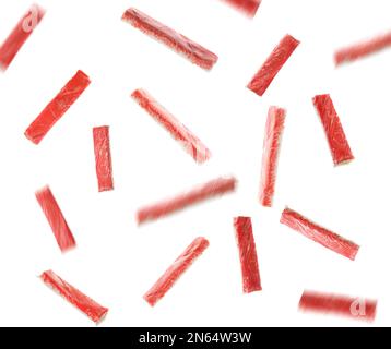 Many fresh crab sticks falling on white background Stock Photo - Alamy
