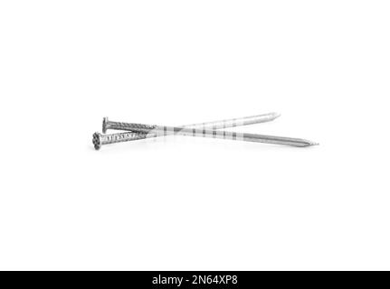 Sharp shiny metal nails on white background Stock Photo - Alamy