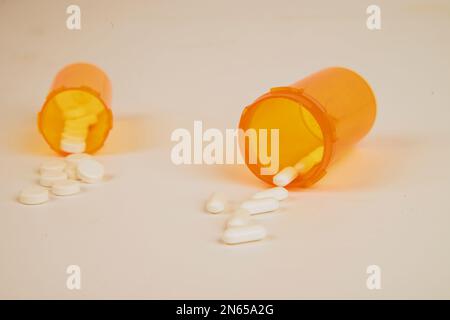 Containers of controlled substances on white background, symbols of ...