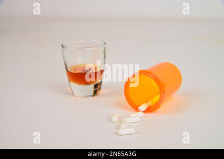 Containers of controlled substances on white background, symbols of ...