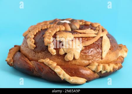 Fresh korovai on light blue background, closeup. Ukrainian bread and ...