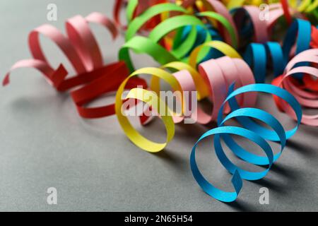 Colorful serpentine streamers on grey background, closeup Stock Photo ...