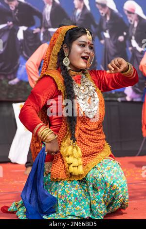 A Tribal woman of Uttarakhand wearing traditional attire dancing in ...