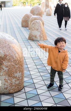 Japanese kid in a city park Stock Photo - Alamy