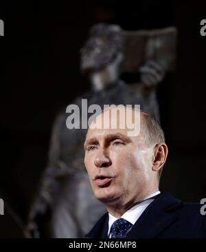 Russian President Vladimir Putin delivers his speech during a meeting ...