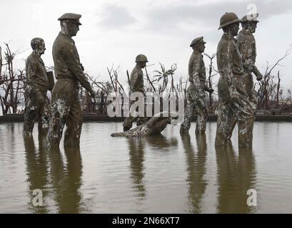 The Philippines, Leyte, Tacloban: statues in the grounds of the CAP ...