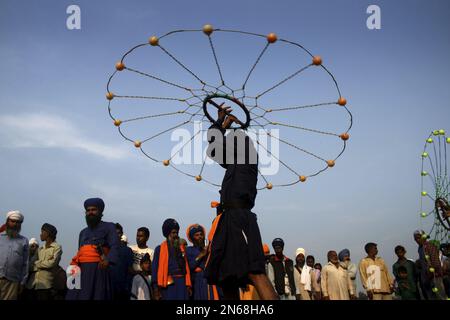 Nihang or Sikh warrior performs Gatka (a form of martial art) using ...