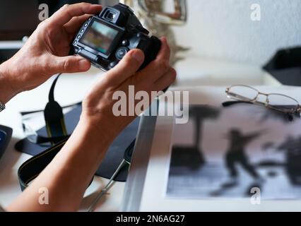 Closeup of mans hands holding camera on blurred light background Stock ...