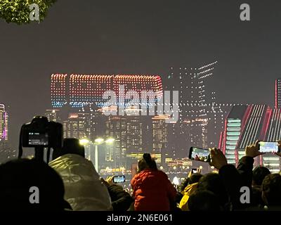 CHONGQING, CHINA - JANUARY 21, 2023 - (FILE) Tourists watch a drone ...