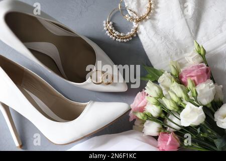 Flat lay composition with wedding dress, white high heel shoes and ...