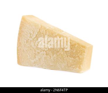 Piece of Parmesan cheese on modern stand. Garlic, fresh basil leaves ...