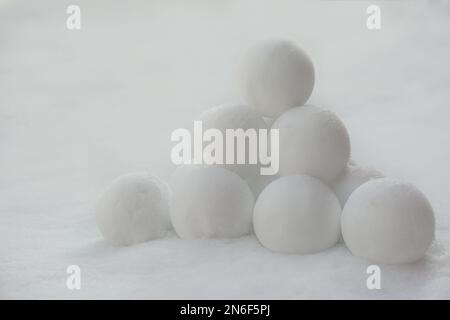 Pyramid of perfect snowballs on snow outdoors Stock Photo - Alamy