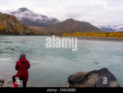 Fisherman at the Altai river Stock Photo - Alamy