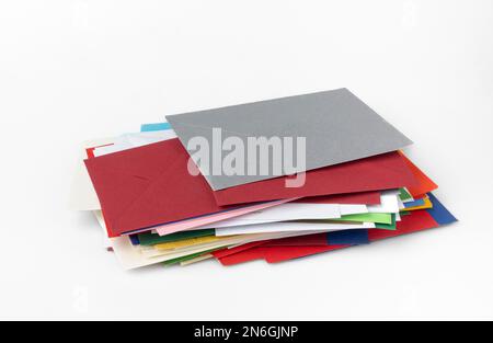 Stack of different paper envelopes on white background. Post office ...