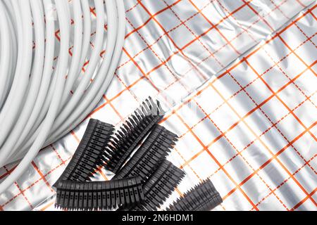 Equipment for installing underfloor heating, stapler with plastic ...