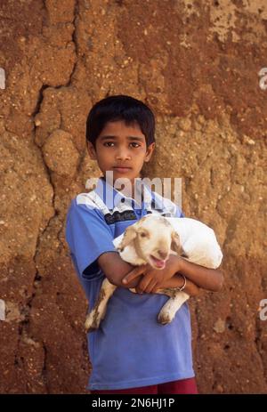 A boy with lamb, Karnataka, India Stock Photo - Alamy