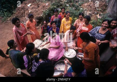Kodava women making rice ball Kadamputtu during Huthri festival, Kodagu ...