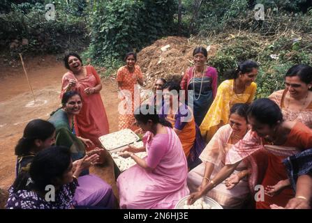 Kodava women making rice ball, Kadamputtu, during Huthri festival ...